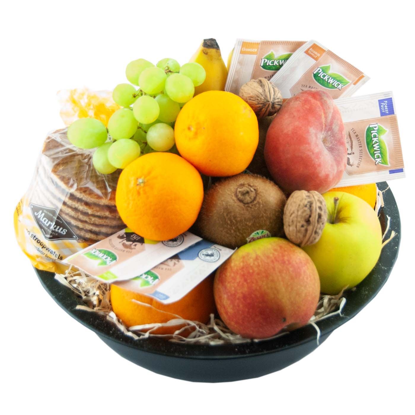 fruitmand seizoensfruit, thee en heerlijke stroopwafels